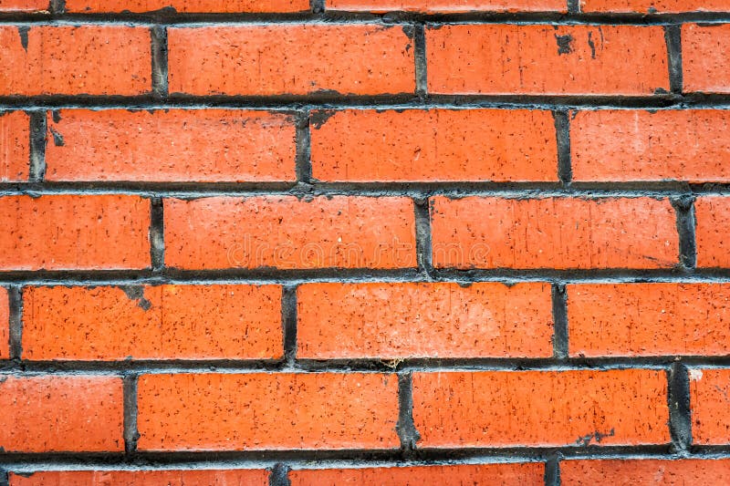 Close Up of a Brick Wall with a Unique Pattern of Orange and Brown ...