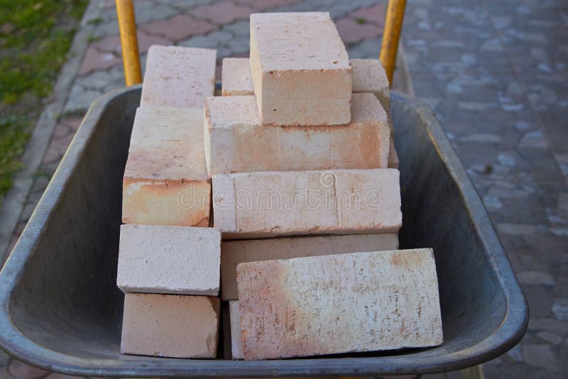 Close Up of a Brick in a Wheelbarrow,red Brick in a Wheelbarrow Lies ...