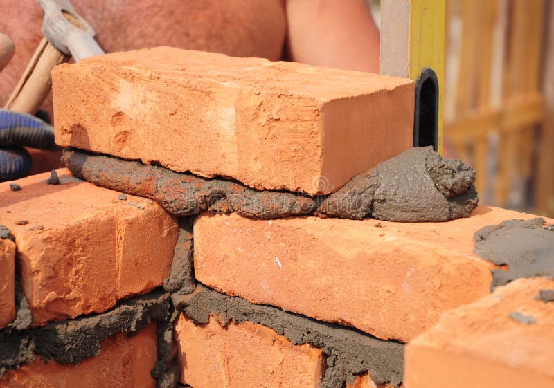 Bricklayer Laying Bricks and Measuring Brick Wall with Spirit Le Stock ...