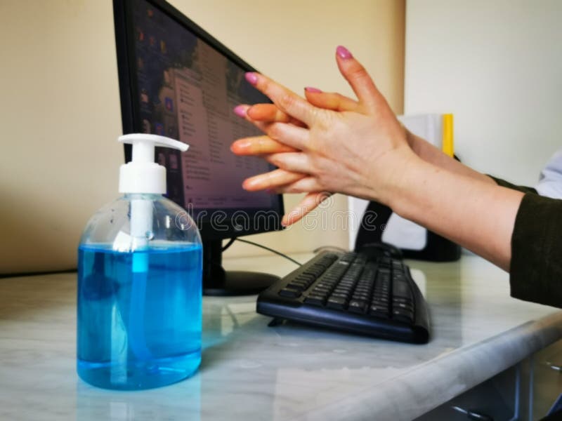 Hand Sanitizing after Working with a Computer. Stock Photo - Image of ...