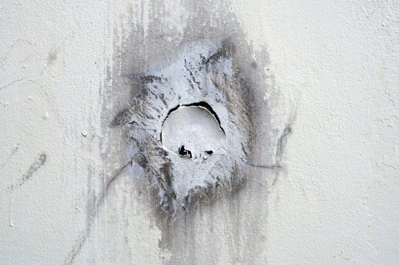 Close Up of a Broken Hole in the Cement Wall of a Building Stock Photo ...