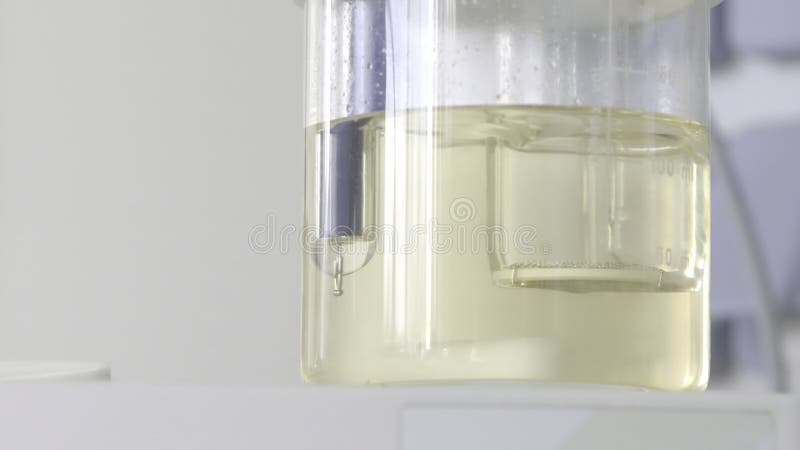 Close Up of Bubbling Liquid Substance Inside Flask at the Laboratory ...