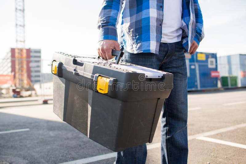 Close Up of Builder Carrying Toolbox Outdoors Stock Photo - Image of ...
