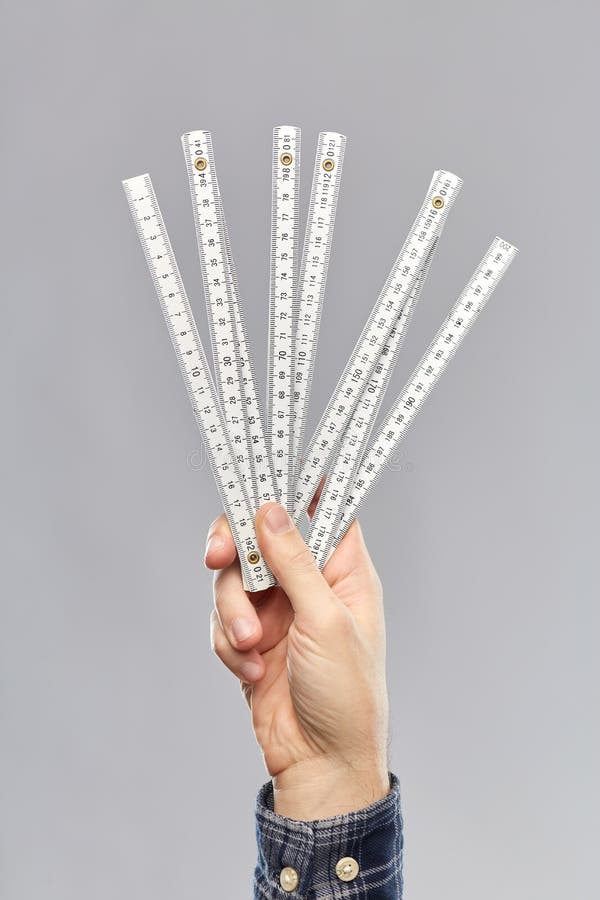 Close Up of Builder`s Hand Holding Folding Ruler Stock Image - Image of ...