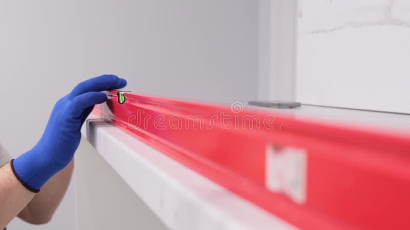 Close-up, the Builder Uses a Water Level at Work. the Concept of Home ...