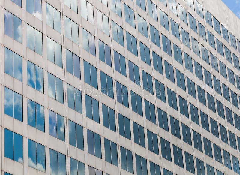 Close Up of Building with Sky Reflecting in the Windows Stock Photo ...