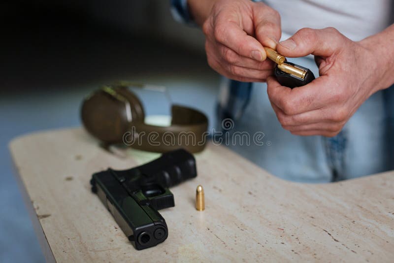 Close Up of a Bullet Being Put into the Cartridge Clip Stock Image ...