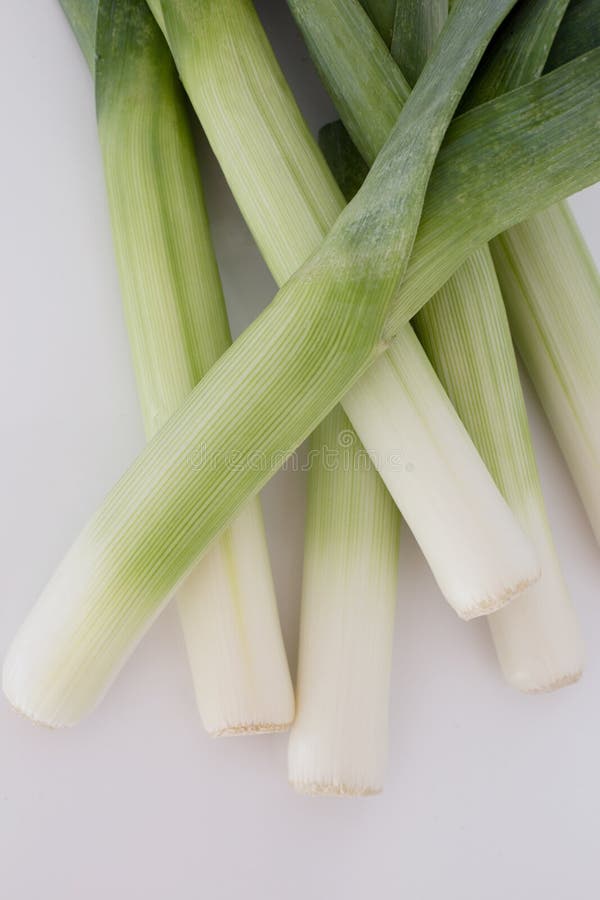 Bunch of Fresh Leeks in a White Background. Top Logo Design Stock Photo ...