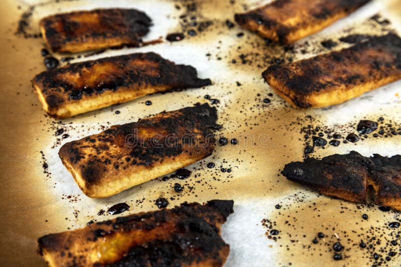 Close Up Burnt Pie Treats on Parchment Paper Stock Image - Image of ...