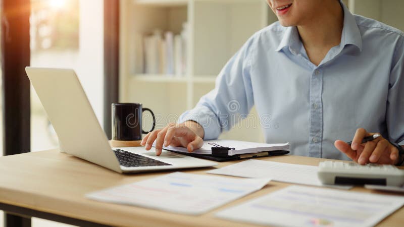Close Up of Business Analyst Calculating Financial Data at Desk Stock ...