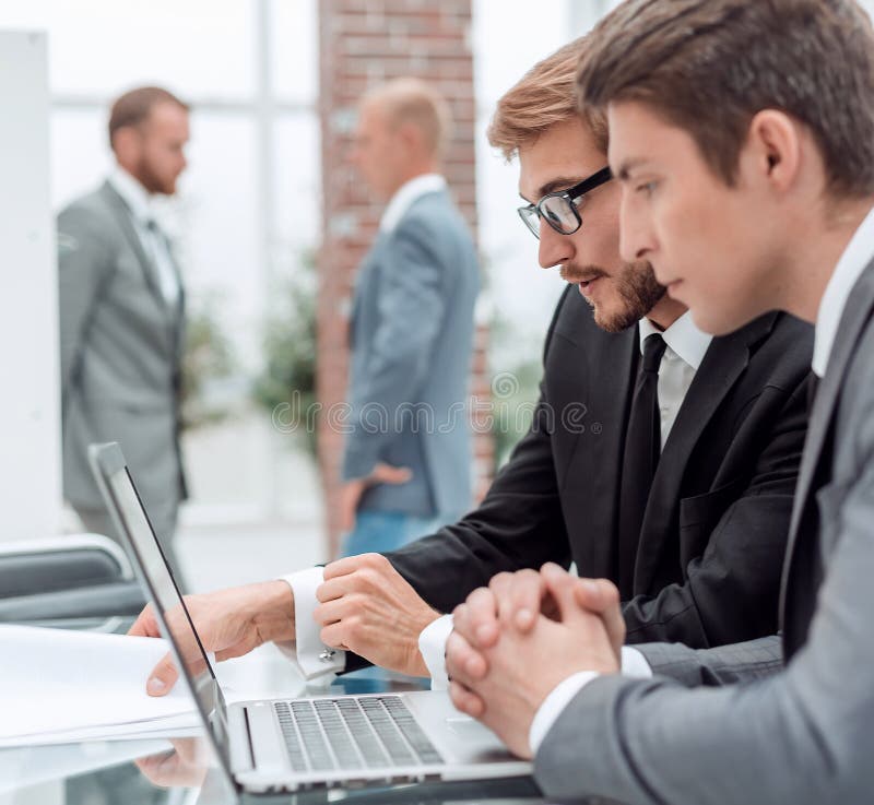 Close Up. Business Colleagues Work on a Laptop in the Office Stock ...