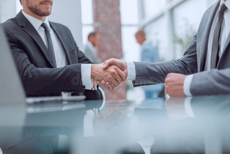 Close Up. Business Handshake at the Negotiating Table Stock Photo ...