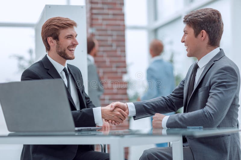 Close Up. Business Handshake at the Negotiating Table Stock Photo ...