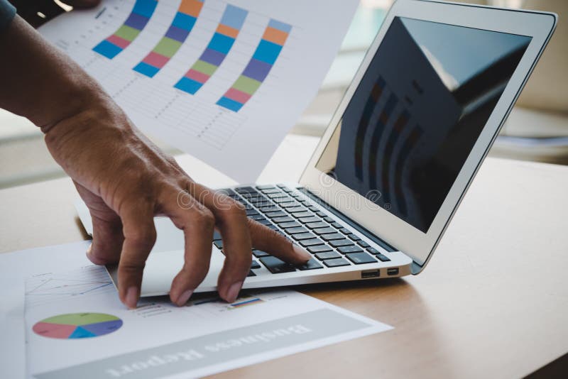 Close Up Business Man Hand Holding Data Sheet Typing Summary Report ...