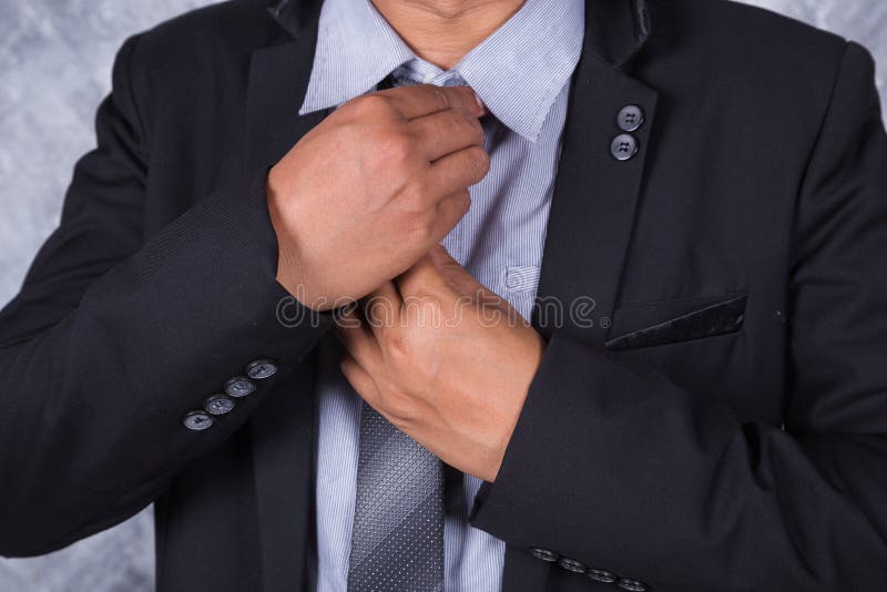 Close Up Business Man in Suit Fixing His Tie Stock Image - Image of ...