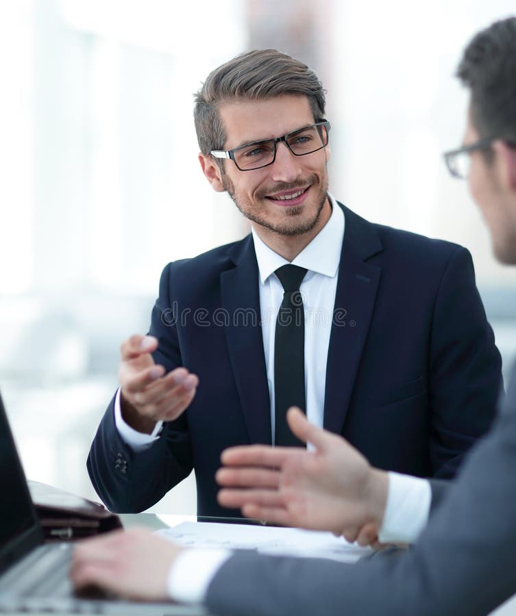 Close Up.business Partners Talk Sitting at a Desk Stock Image - Image ...