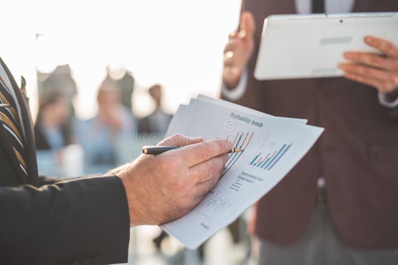 Close Up. Business People Analyzing Financial Data Stock Image - Image ...