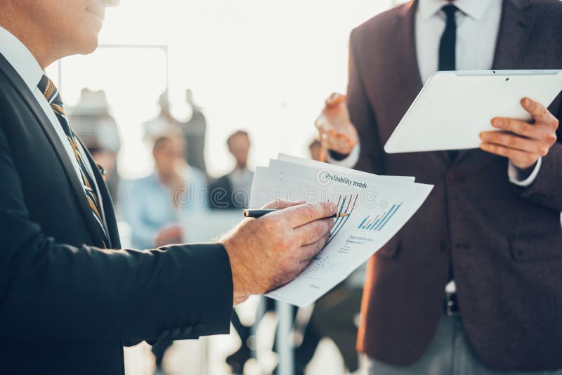 Close Up. Business People Analyzing Financial Data Stock Photo - Image ...