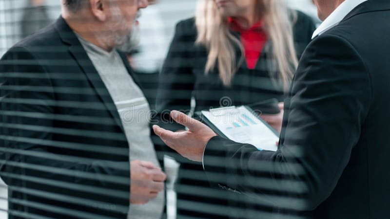 Close Up . Business People Talking Standing in the Office Stock Photo ...