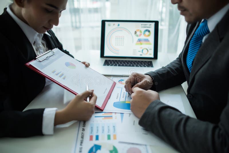 Close Up of Business People Working with Business Document during ...