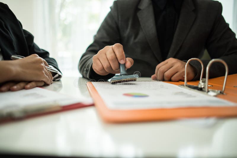 Close Up of Business People Working with Business Document during ...