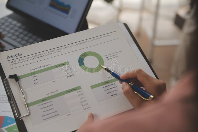 Close Up of Business Team Analyzing Income Charts and Graphs with ...