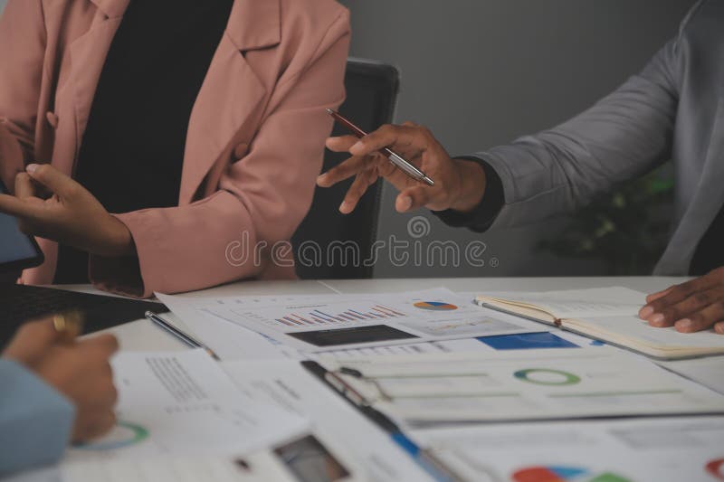 Close Up of Business Team Analyzing Income Charts and Graphs with Modern Laptop Computer ...
