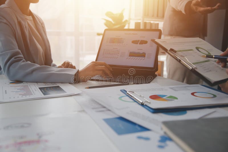 Close Up of Business Team Analyzing Income Charts and Graphs with ...