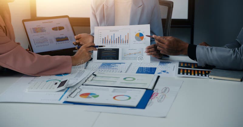 Close Up of Business Team Analyzing Income Charts and Graphs with ...