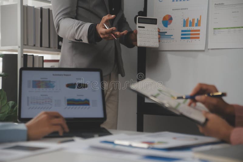 Close Up of Business Team Analyzing Income Charts and Graphs with ...