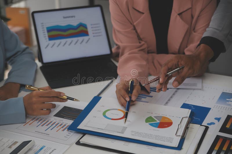 Close Up of Business Team Analyzing Income Charts and Graphs with ...