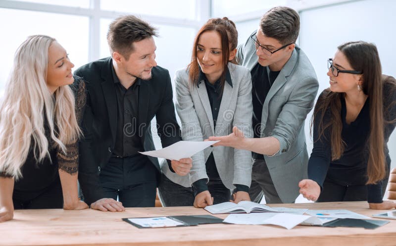 Close Up. Business Team Enthusiastically Discuss Working Documents ...