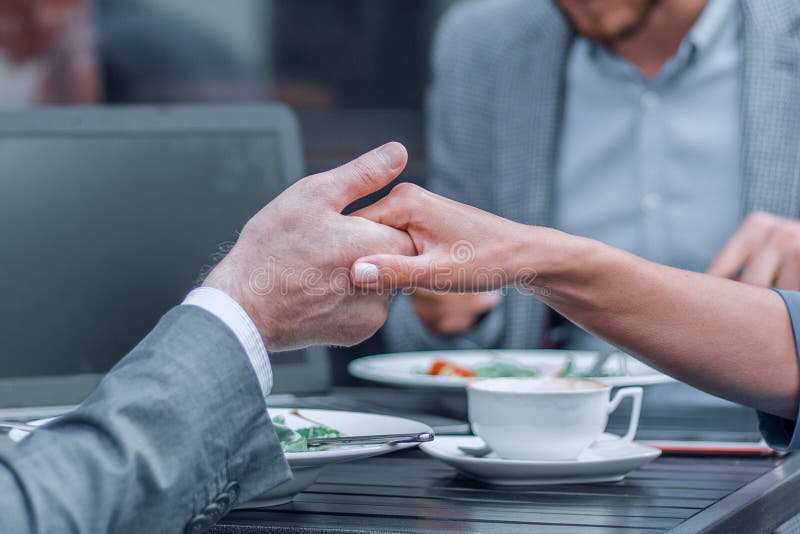 Close Up.business Team Sitting at a Table in a Cafe Stock Image - Image ...