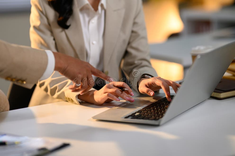 Close Up of Business Teamwork Sharing Input and Reviewing Data during a ...