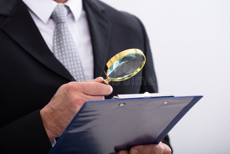 Man Analyzing Document through Magnifying Glass Stock Image - Image of ...