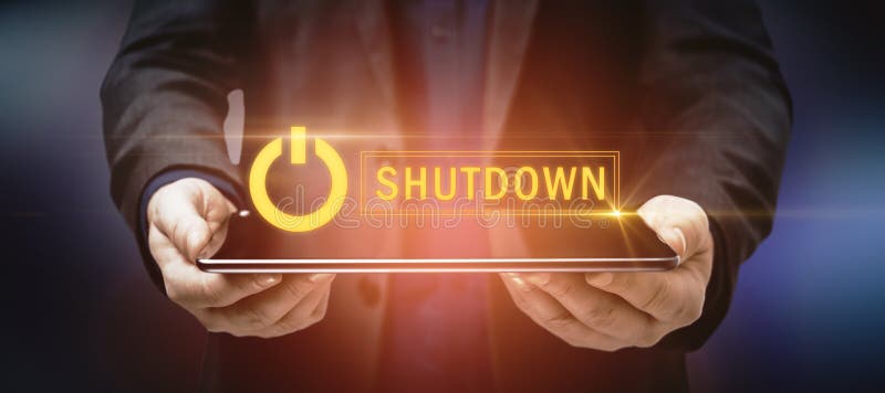 Close Up of Businessman Hands Holding Tablet with Glowing Shutdown Text ...