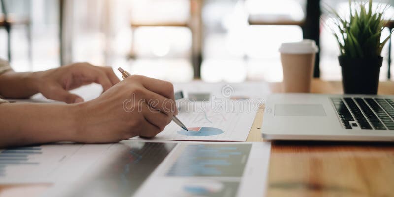 Close Up of a Businessman Holding Graph Paper and Pen Stock Photo ...