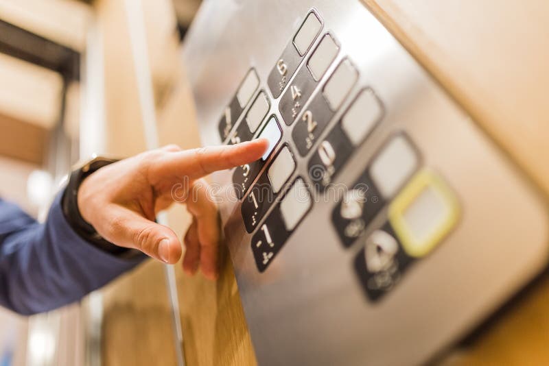 Man Pressing Modern Elevator Button with His Forefinger Stock Photo ...