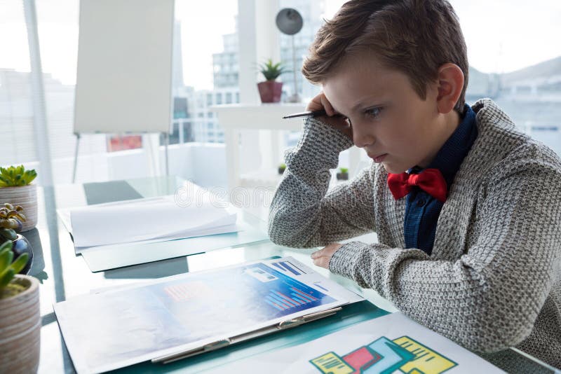 Close Up of Businessman Reading Documents while Sitting at Desk Stock ...
