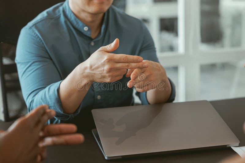 Close Up of Businessman Using Sign Language while Talking with Client ...