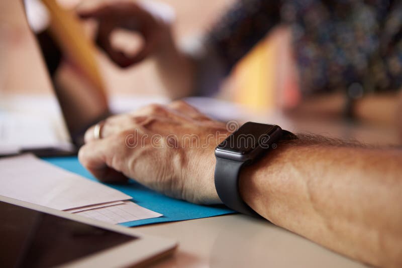 Close Up of Businessman Wearing Smart Watch in Design Office Stock ...