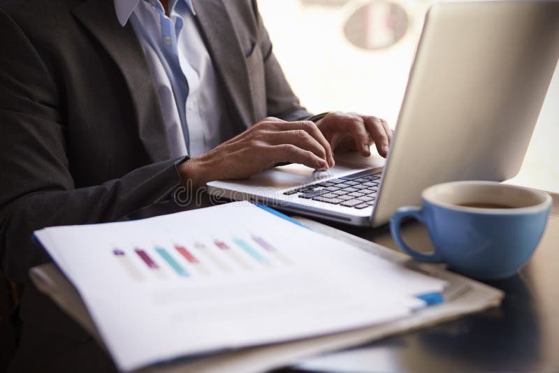 Close Up of Businessman Working on Laptop by Office Window Stock Photo ...