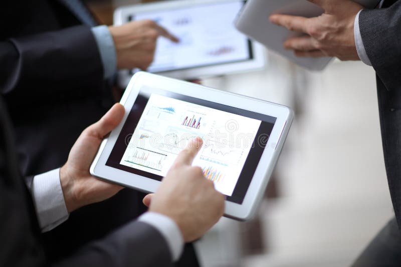 Close Up.businessmens Discuss Schedule of Sales through the Tab Stock ...