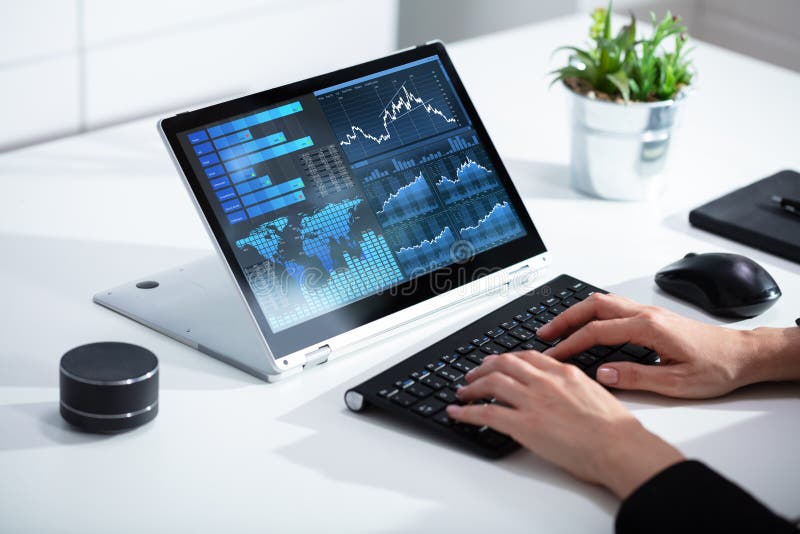 Businesswoman Analyzing Graph on Laptop at Workplace Stock Image ... Businesswoman Analyzing Graph on Laptop at Workplace Stock Image ...