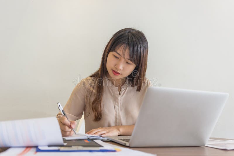 Close-up of Businesswoman Writing Notes in Office Stock Image - Image ...
