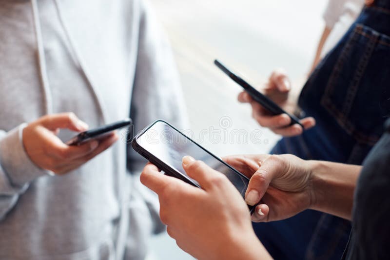 Close Up of Businesswomen Using Mobile Phones in Modern Office Stock ...
