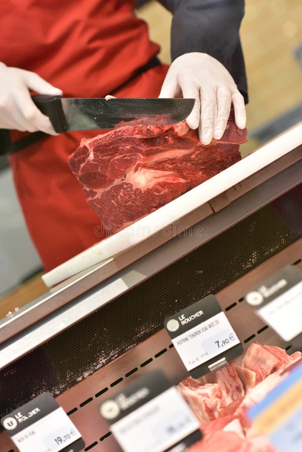 Close-up of Butcher S Hand Cutting Meat for Client Stock Photo - Image ...