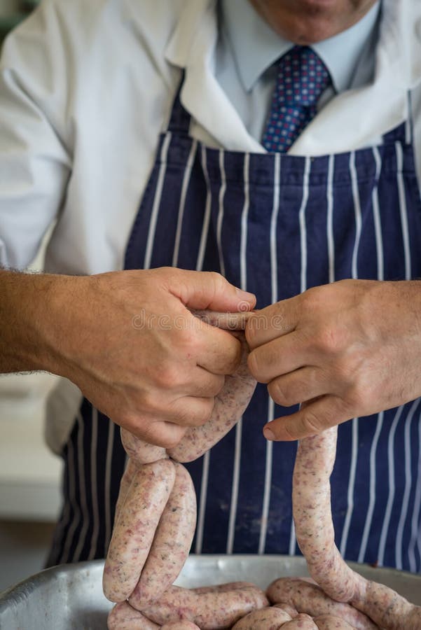 Close Up of Butchers Hands Linking Sausages Stock Photo - Image of ...
