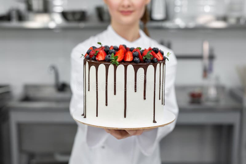 Close-up of a Cake in the Hands of a Pastry Chef Stock Photo - Image of ...
