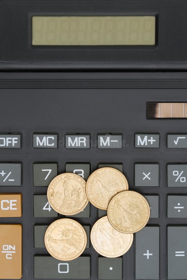 Close-up of a Calculator with Gold Coins Stock Photo - Image of screen ...
